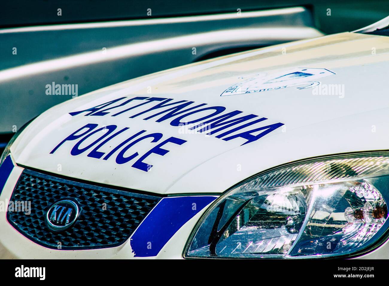 Closeup of an official police car patrolling the streets of the city ...