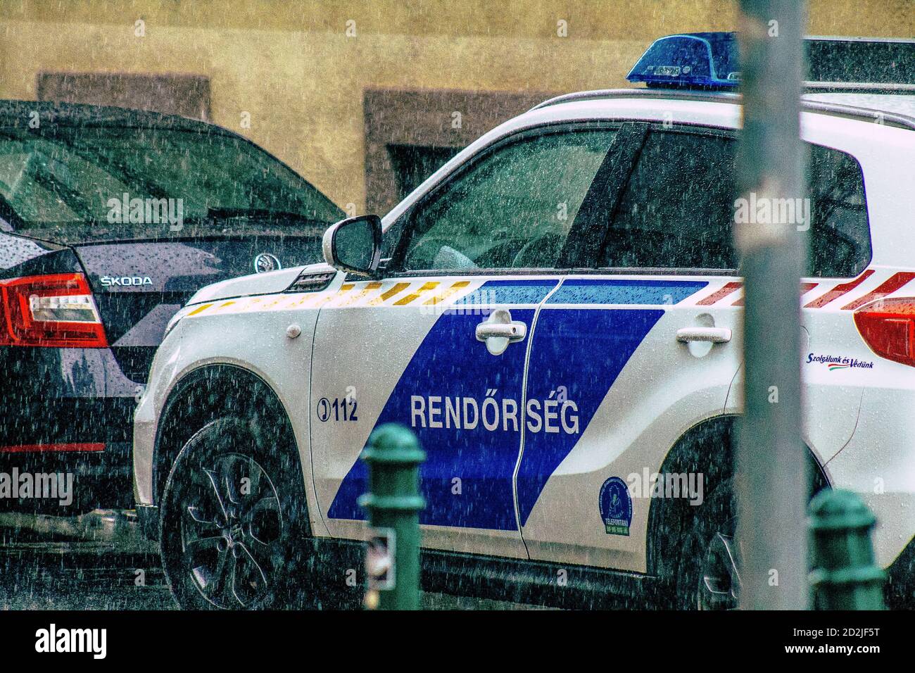 Closeup of an official police car patrolling the streets of the city ...