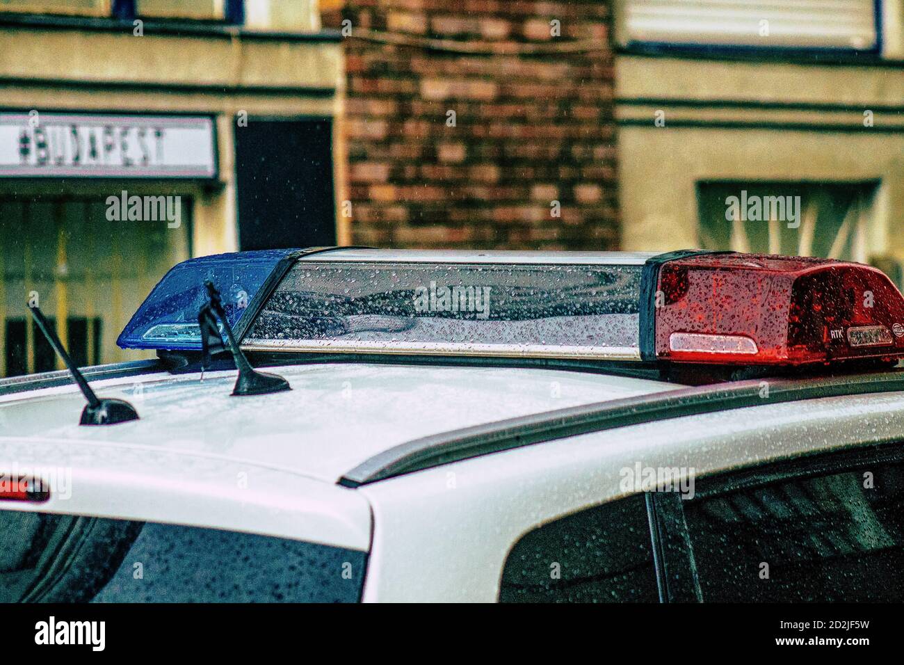Closeup of an official police car patrolling the streets of the city ...