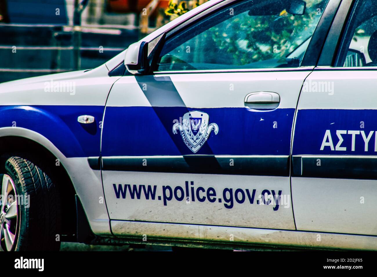 Closeup of an official police car patrolling the streets of the city ...
