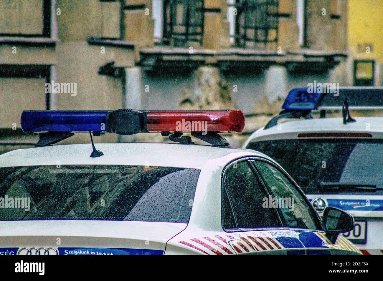Closeup of an official police car patrolling the streets of the city ...