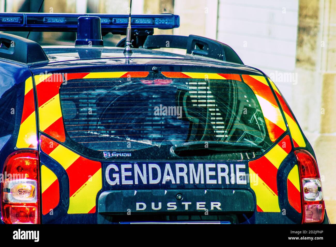 Closeup of an official police car patrolling the streets of the city ...