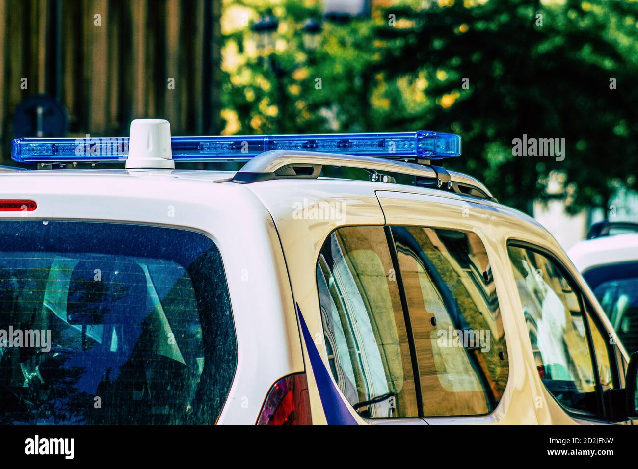 Closeup of an official police car patrolling the streets of the city ...
