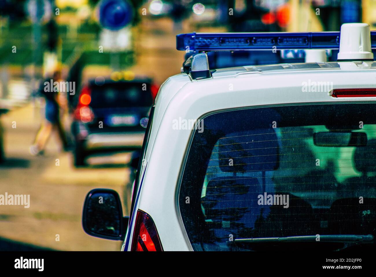 Closeup of an official police car patrolling the streets of the city ...