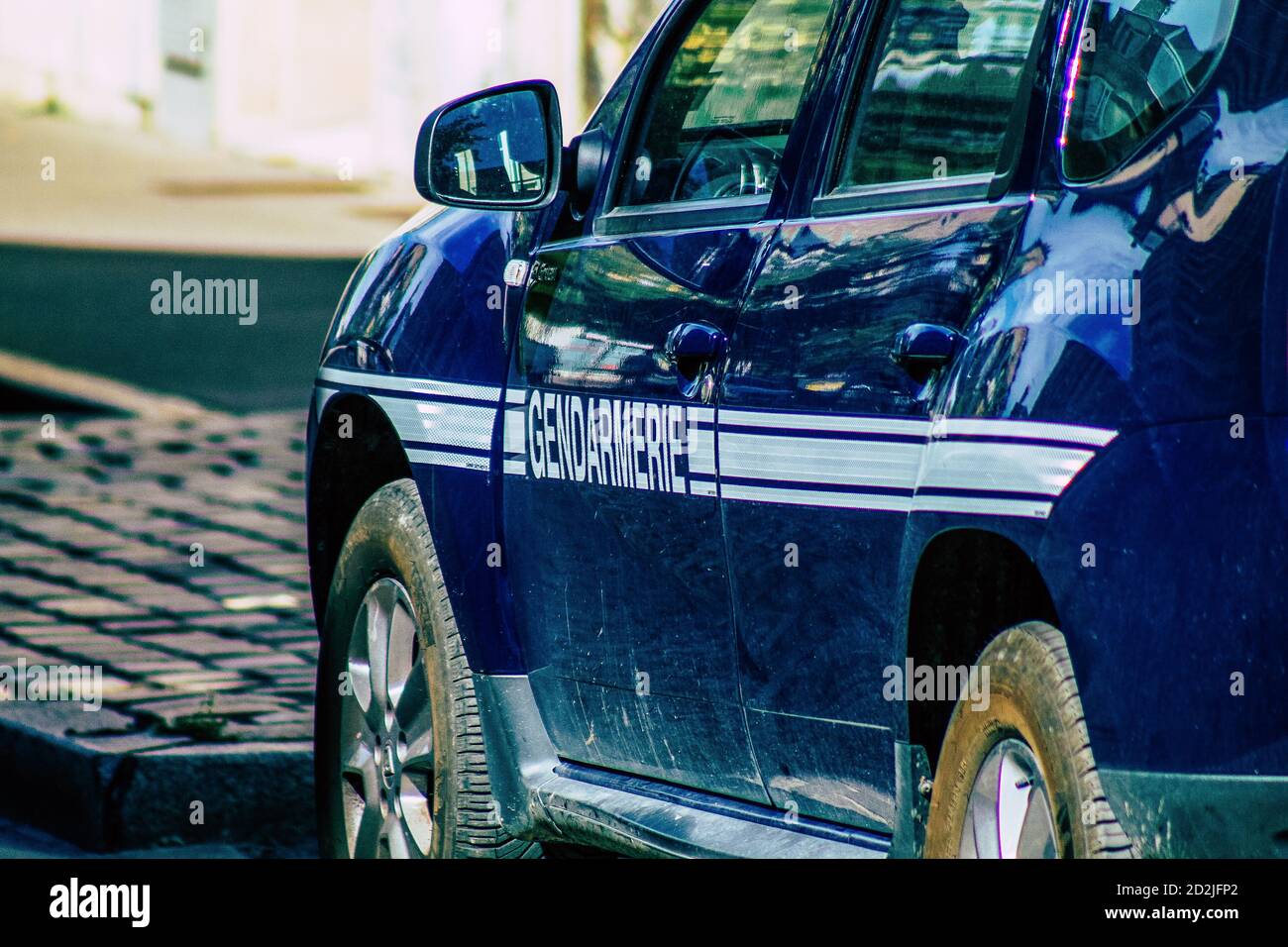 Closeup of an official police car patrolling the streets of the city ...