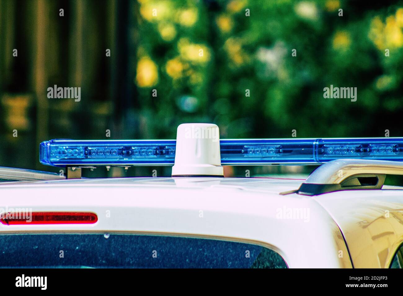 Closeup of an official police car patrolling the streets of the city ...