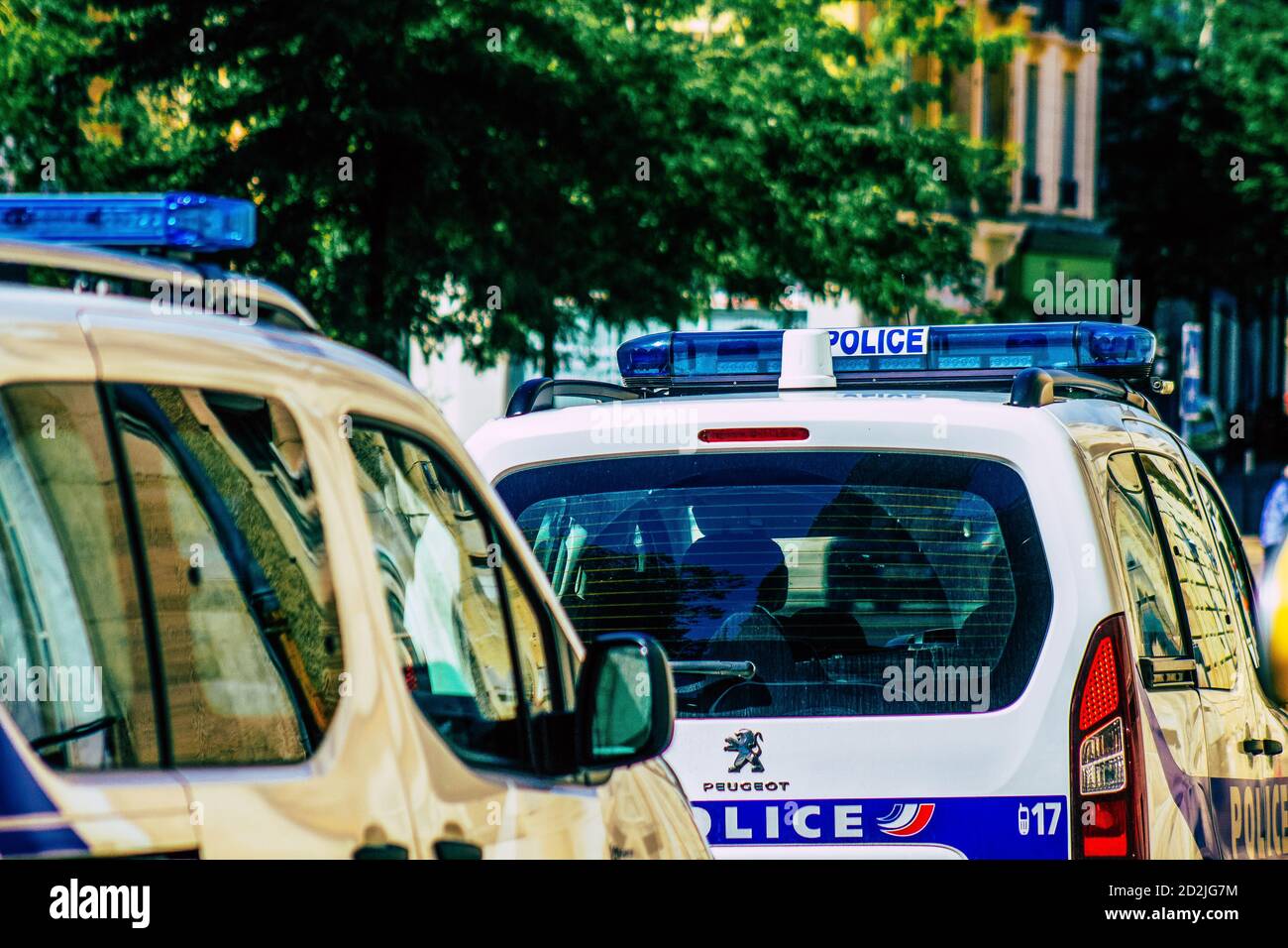 Closeup of an official police car patrolling the streets of the city ...