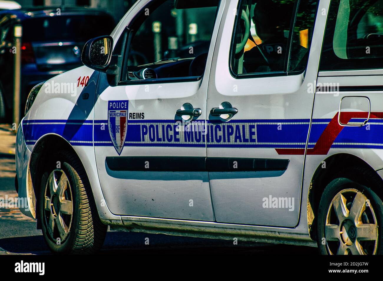 Closeup of an official police car patrolling the streets of the city ...