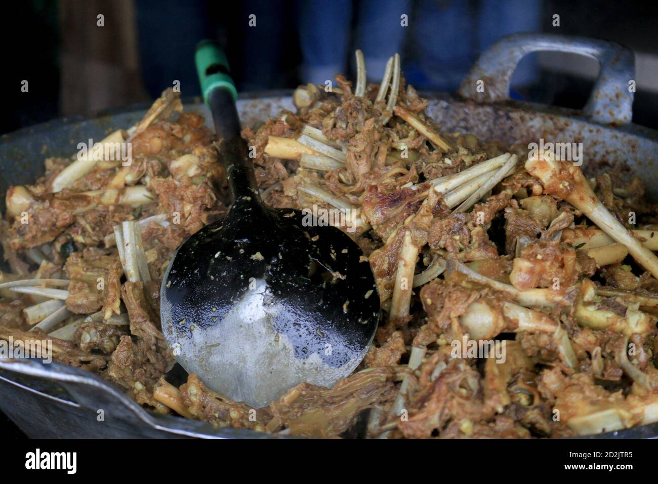 Cooking Tengkleng in big pan. goat meat with ribs and bone cooked with ...