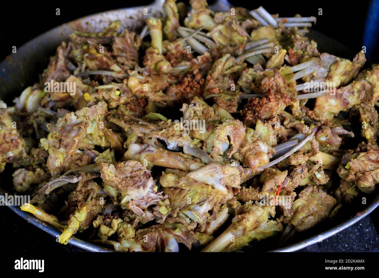 Cooking Tengkleng in big pan. goat meat with ribs and bone cooked with ...