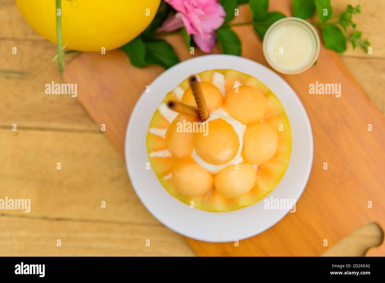 Melon Bingsoo with Sweetened Condensed Milk on wood table Stock Photo ...