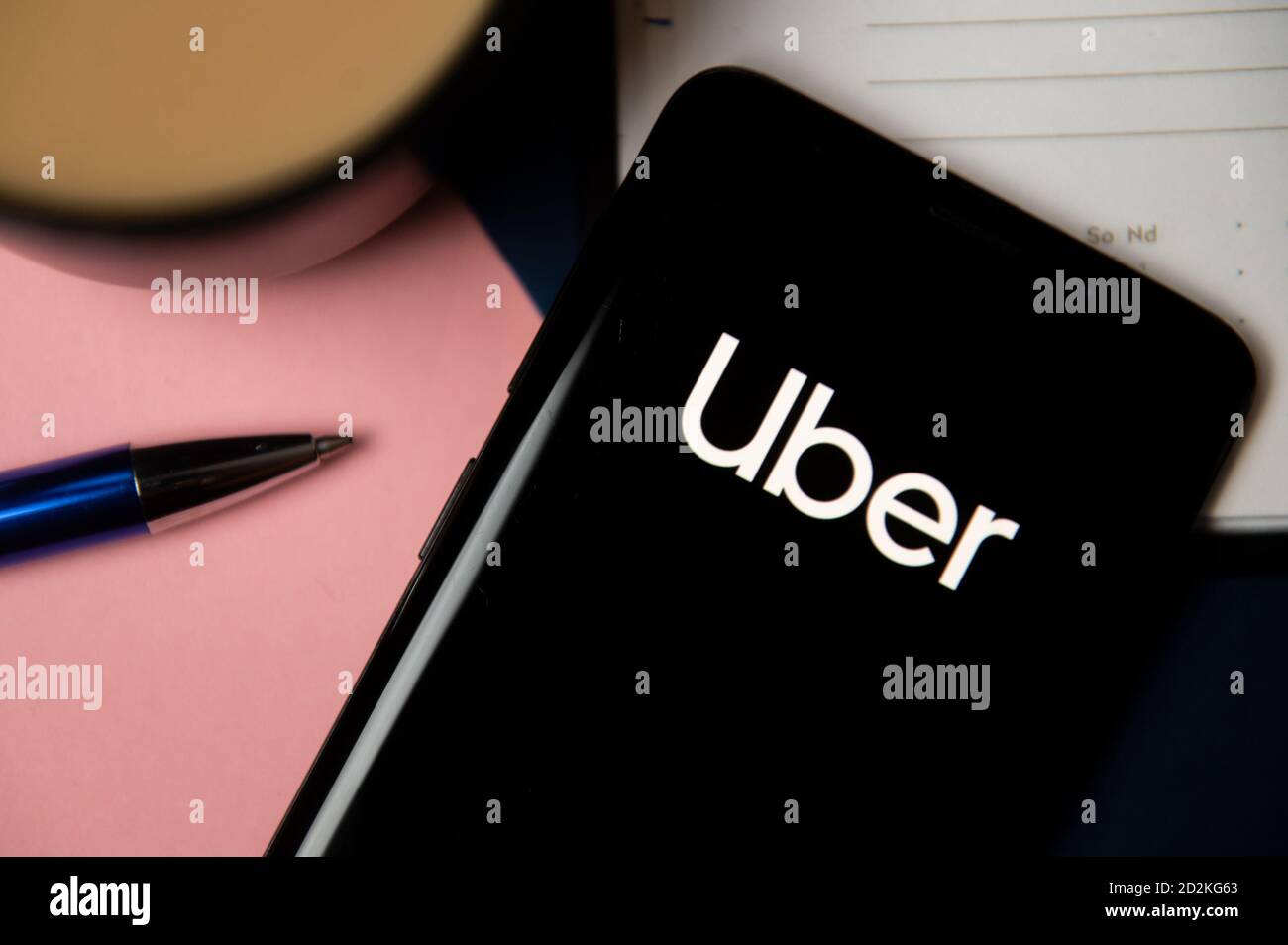 In this photo illustration an Uber logo displayed on a smartphone Stock ...