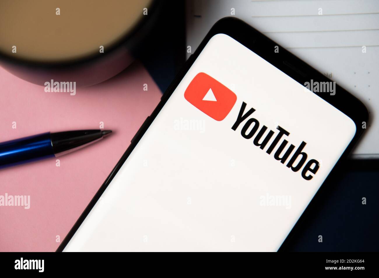 In this photo illustration a YouTube logo displayed on a smartphone ...