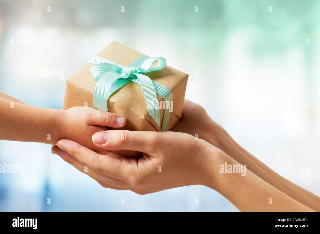 human hands holding a gift Stock Photo - Alamy