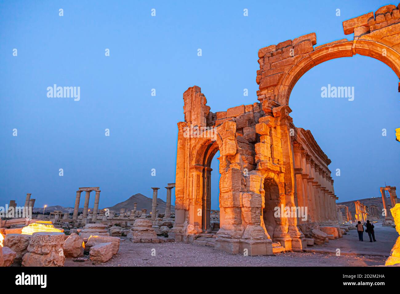 landscape image of the ancient city of Palmyra at night right before ...