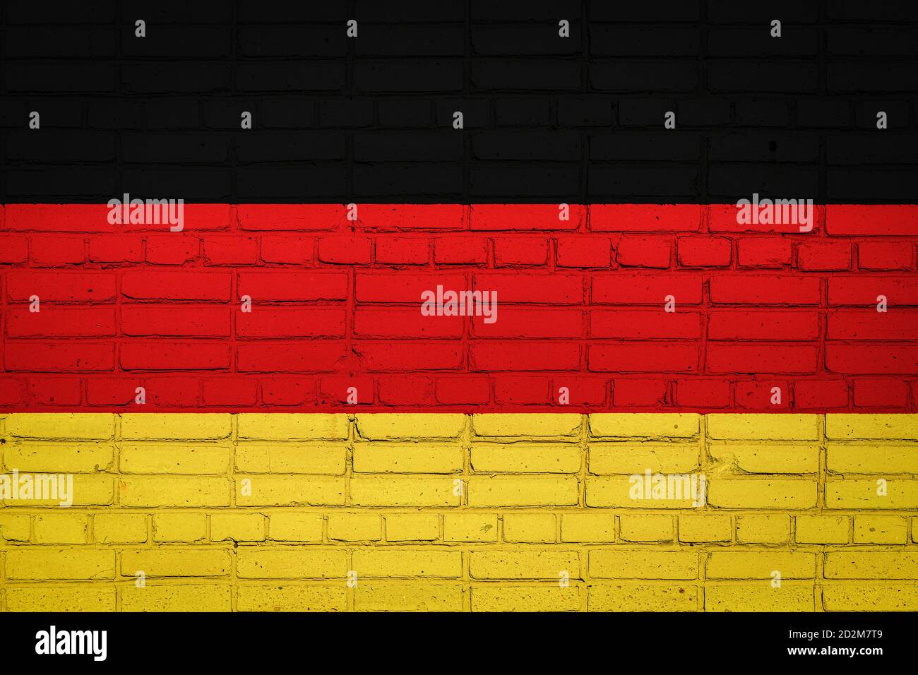 National flag of Germany depicting in paint colors on an old brick wall ...