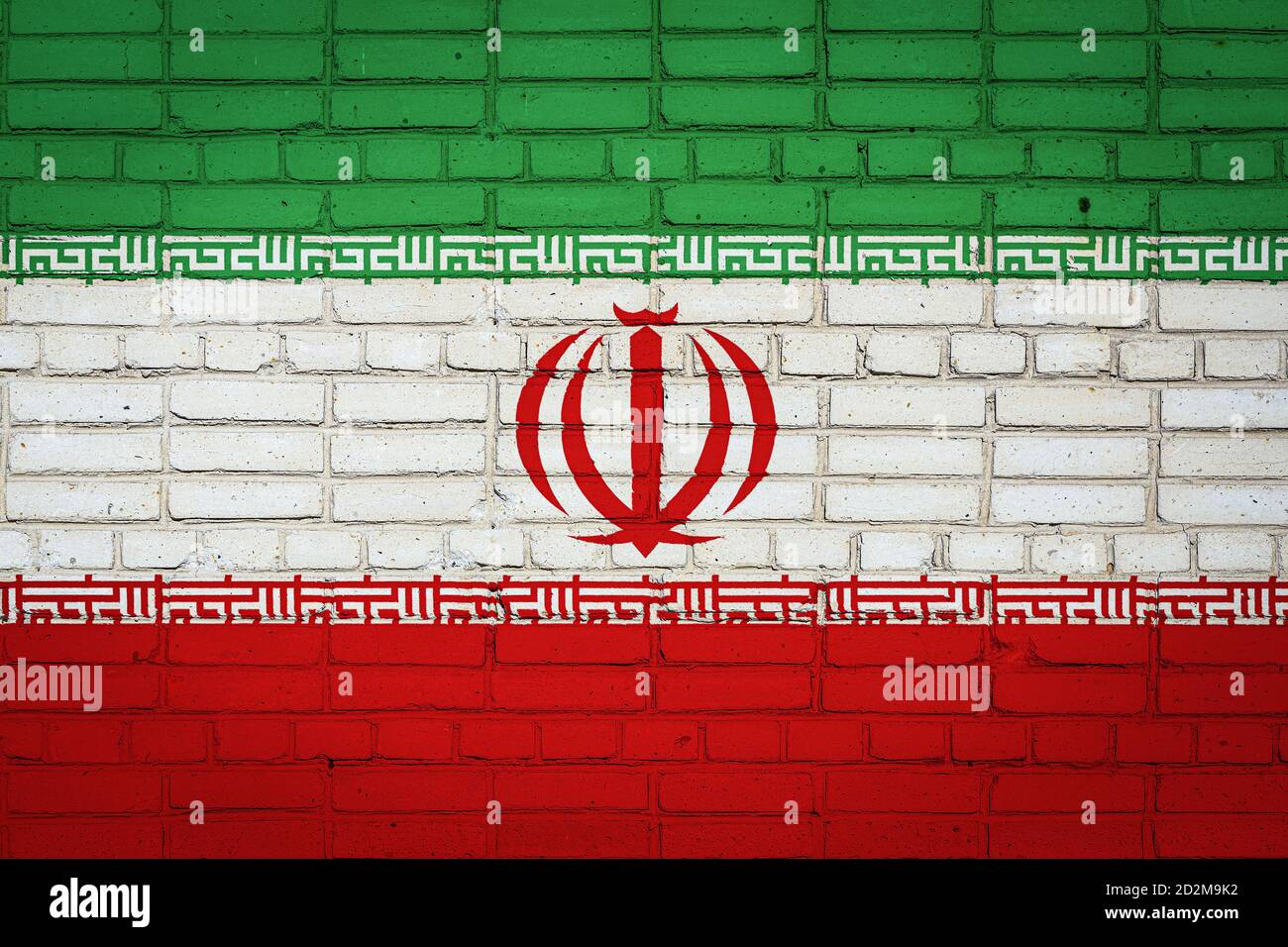 National flag of Iran depicting in paint colors on an old brick wall ...