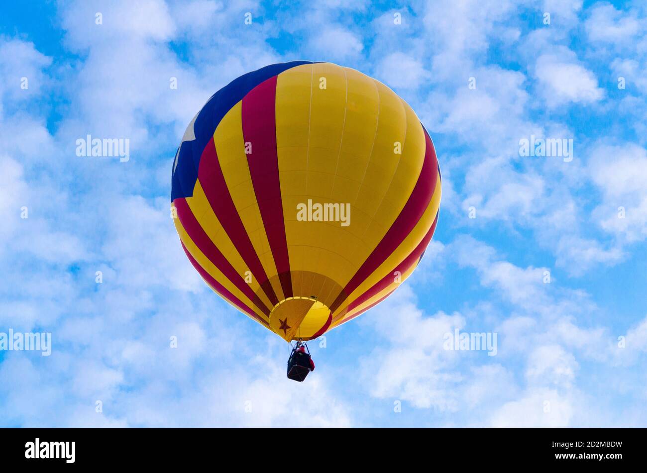 Low angle shot of a hot air balloon floating in the air Stock Photo - Alamy