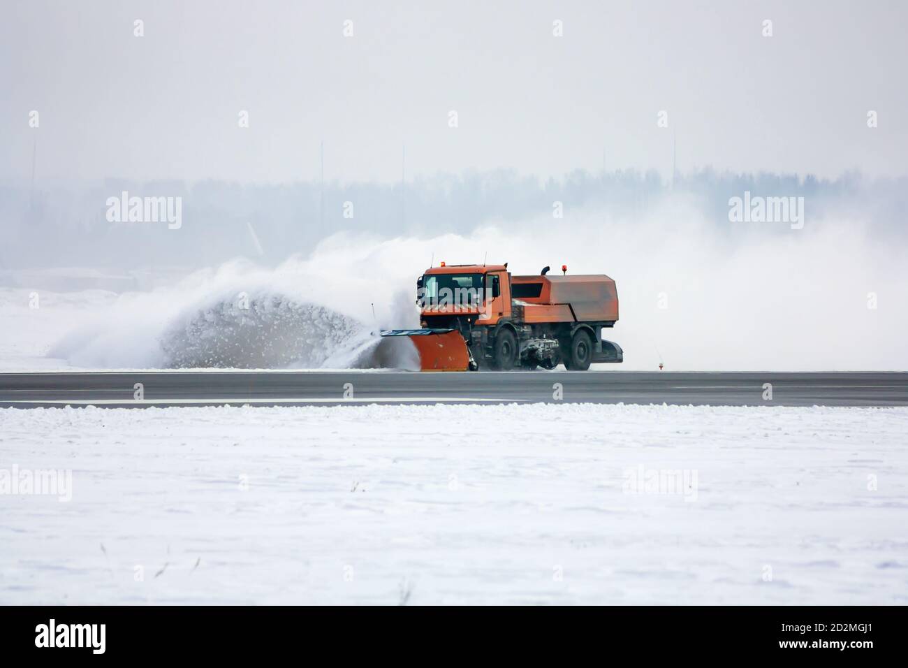 Snow-removal machine cleans the runway at the airport Stock Photo - Alamy