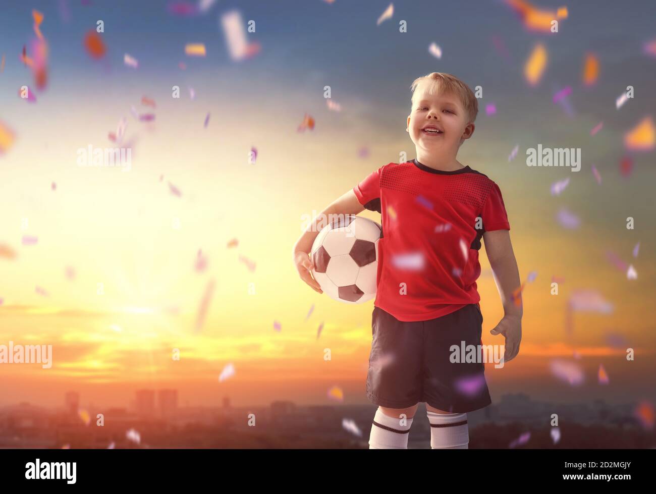 Cute little child dreaming of becoming a soccer player. Boy playing ...