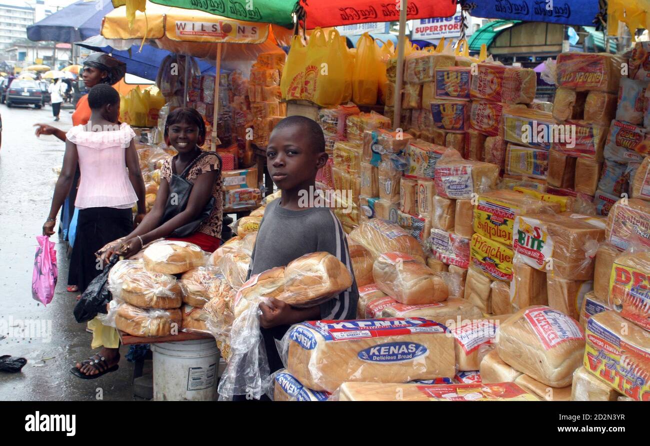Woman selling bread on street hi-res stock photography and images - Alamy
