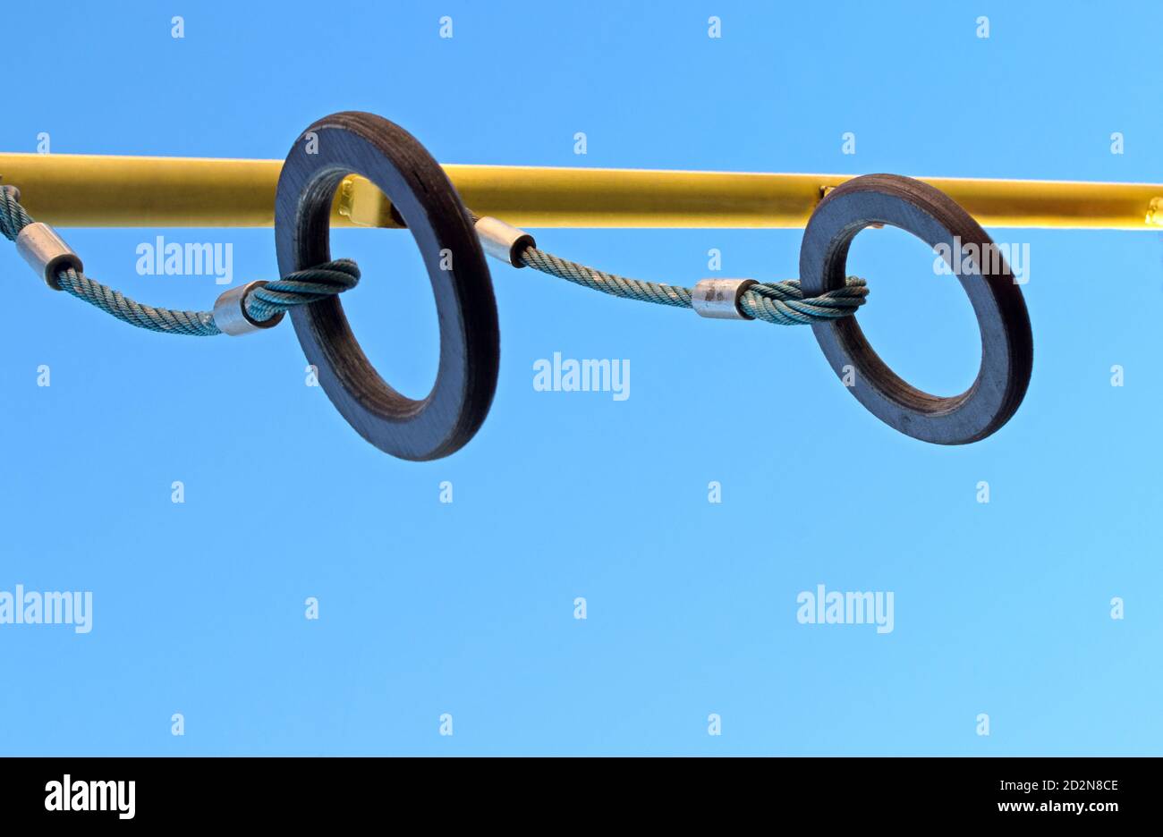 Swinging from metal rings hi-res stock photography and images - Alamy