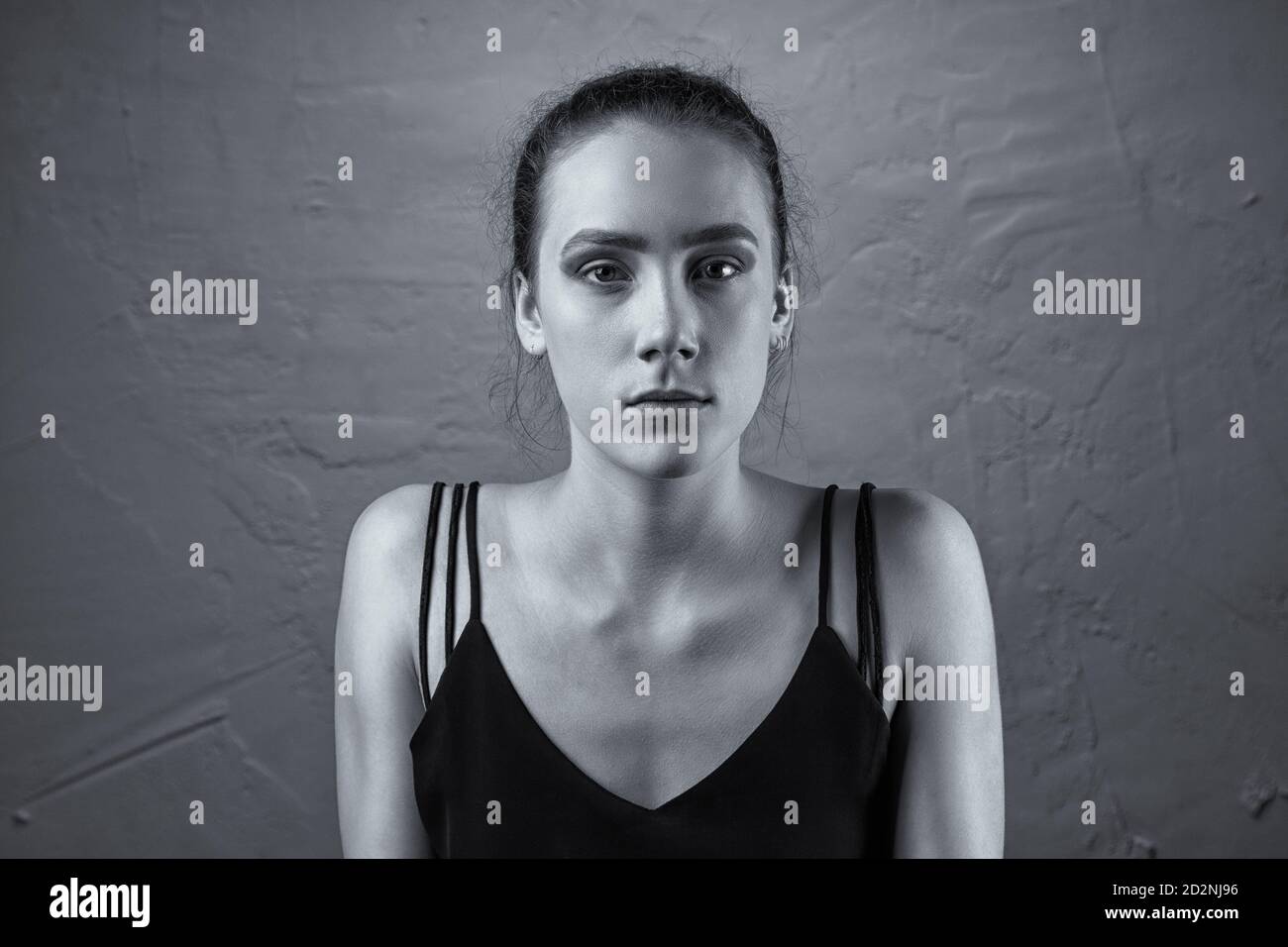 Black and white photo of young woman with unfinished makeup Stock Photo ...