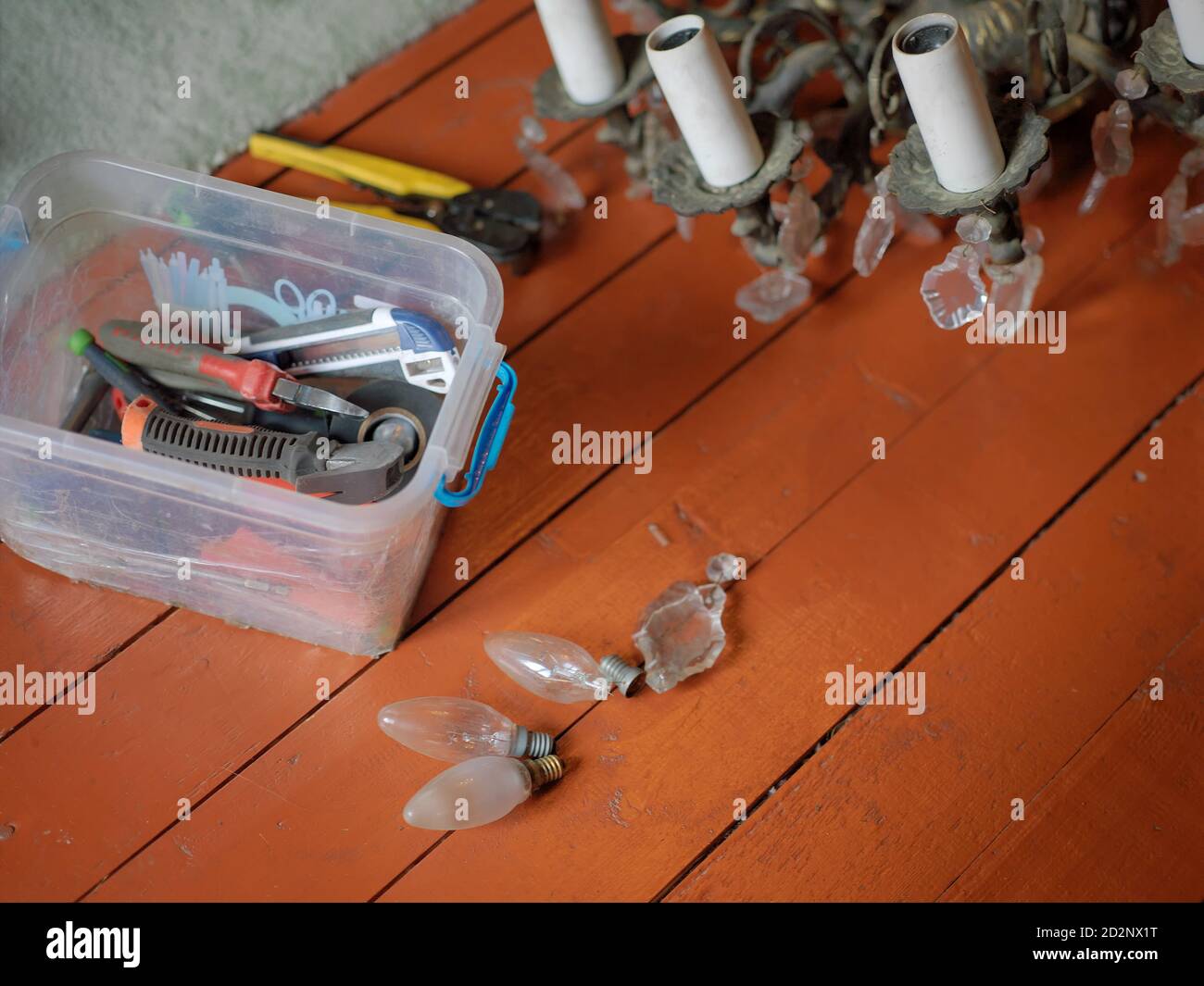 Repair of old bronze chandelier dropped on the floor Stock Photo - Alamy