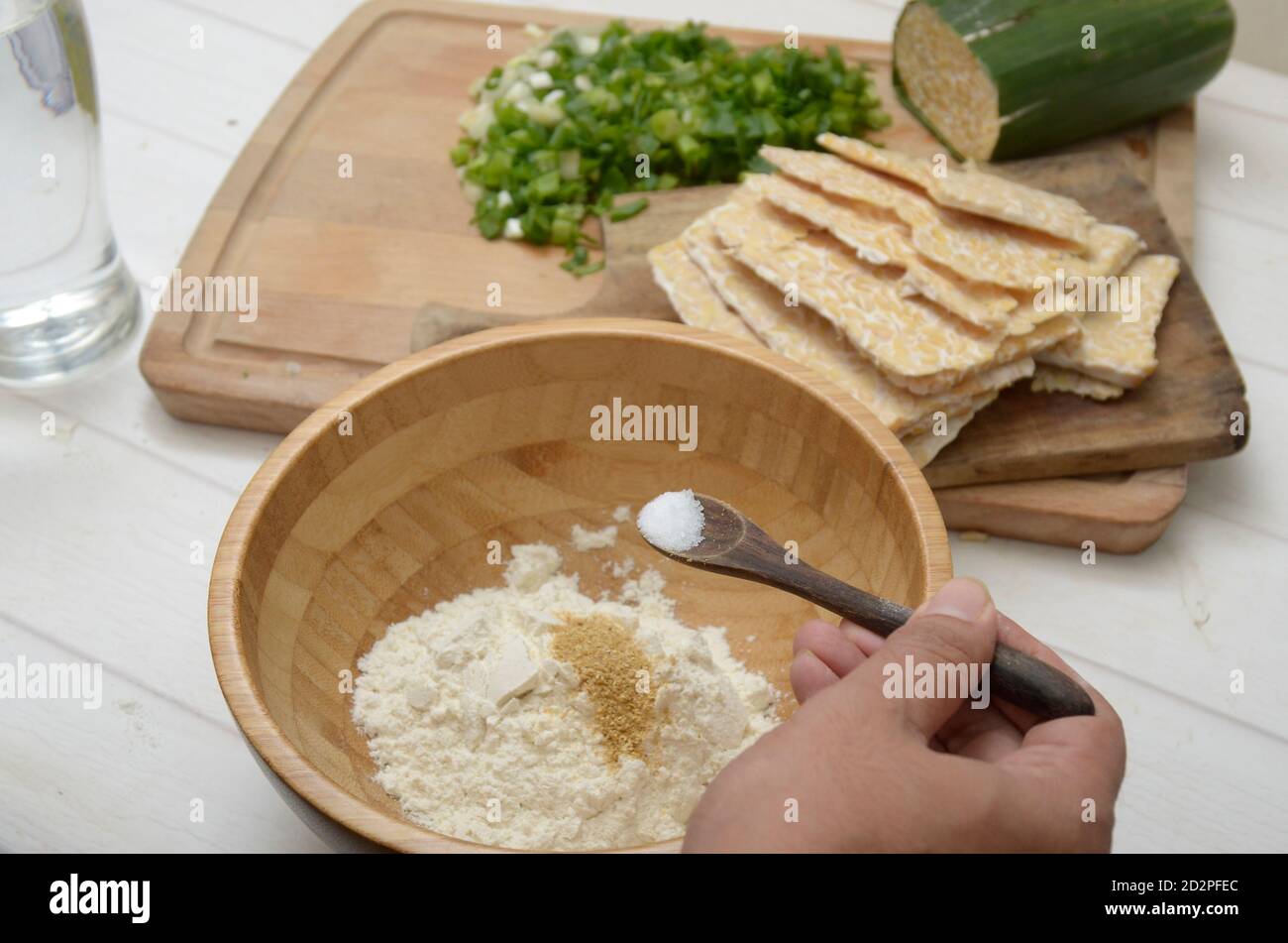 a half spoon of salt powder put in the dough, making mendoan tempeh ...