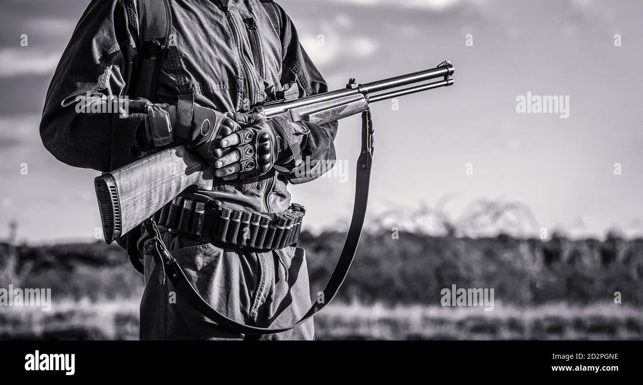 The man is on the hunt. Hunting period. Male with a gun. Hunter with a ...