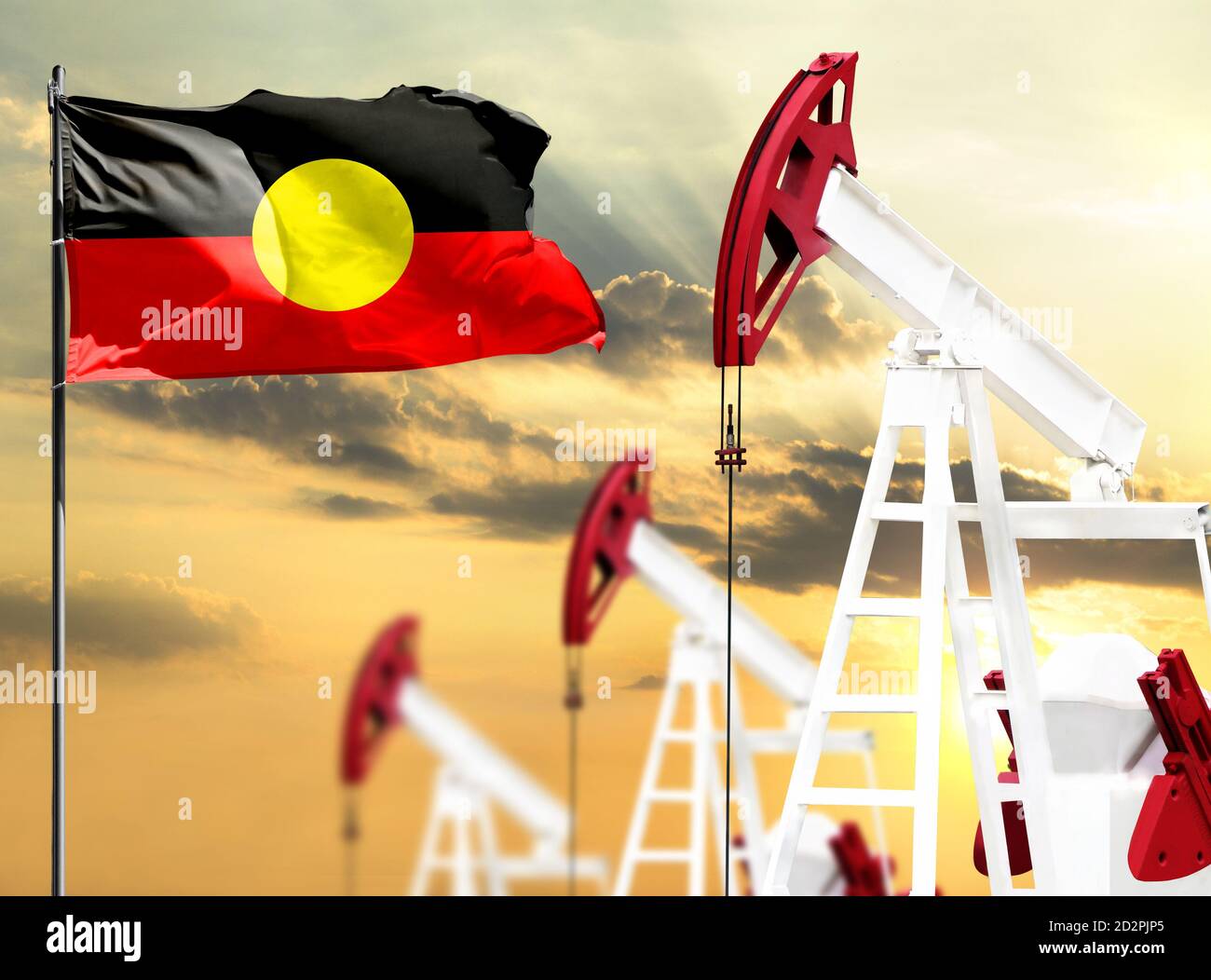 Oil rigs against the backdrop of the colorful sky and a flagpole with ...