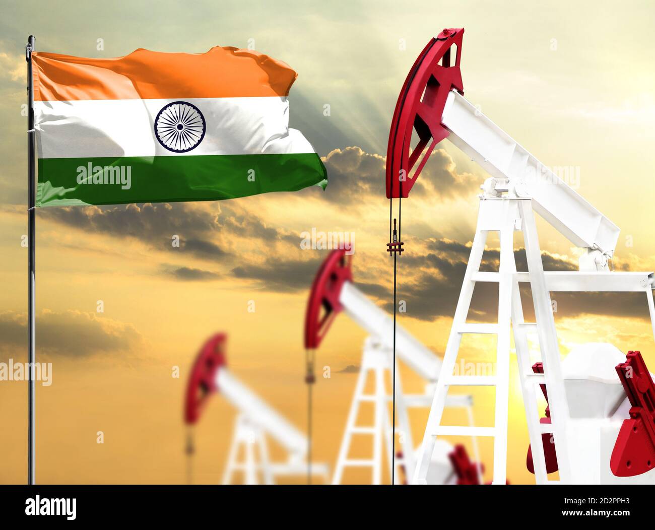 Oil rigs against the backdrop of the colorful sky and a flagpole with ...