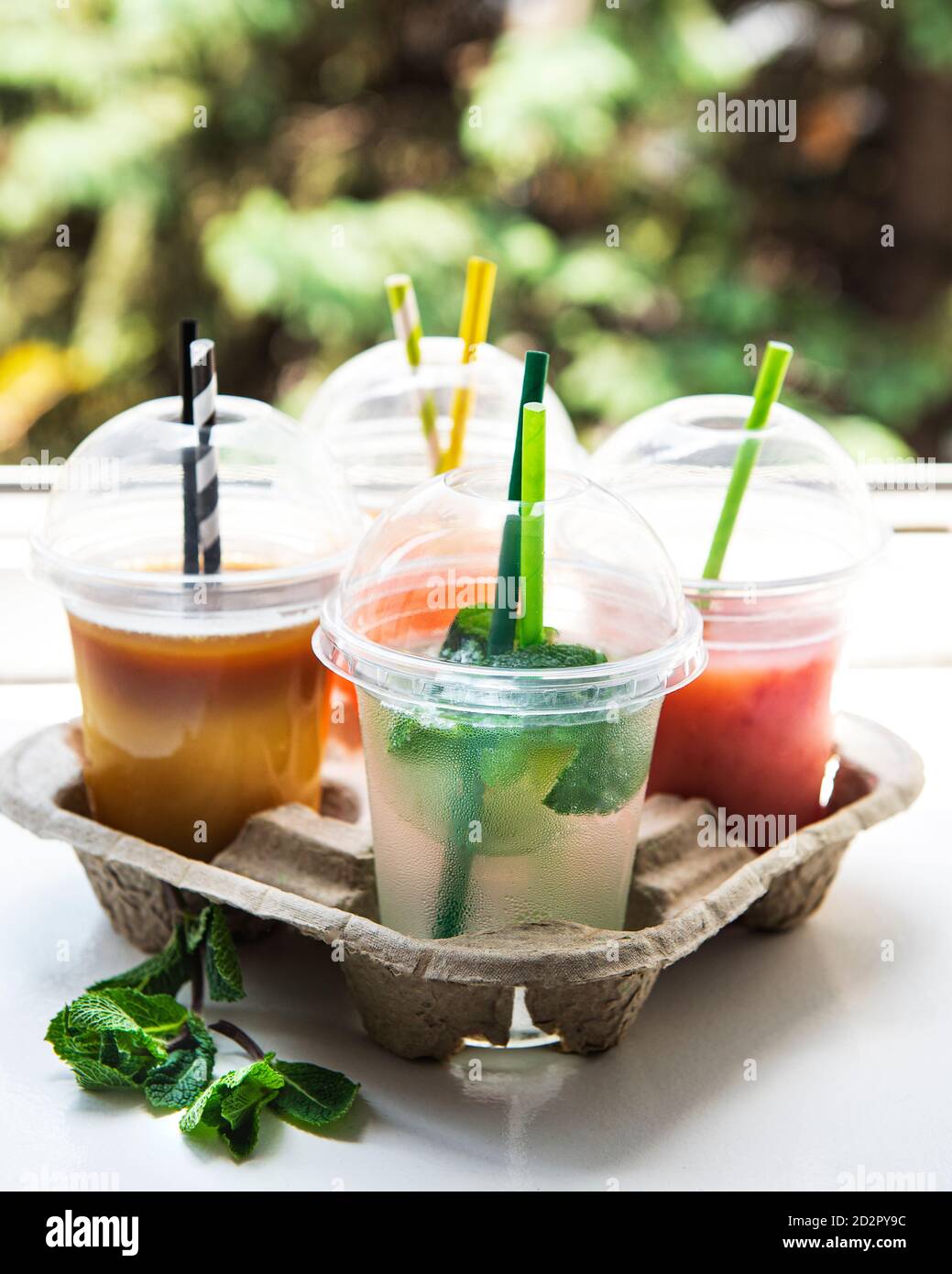 Various summer cold drinks and cocktails in a paper holder Stock Photo ...