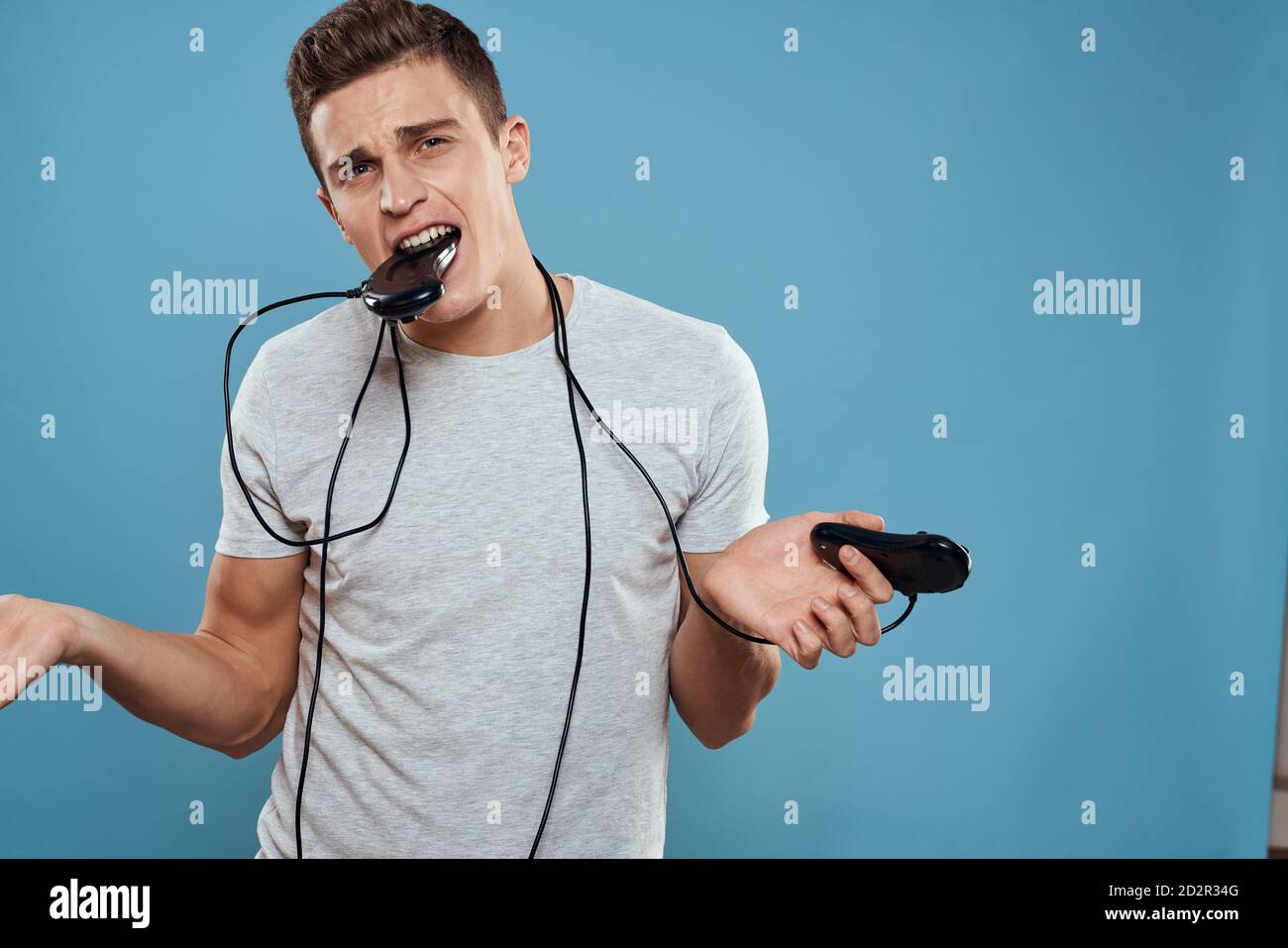 Man with joysticks wires technology games entertainment leisure fun ...