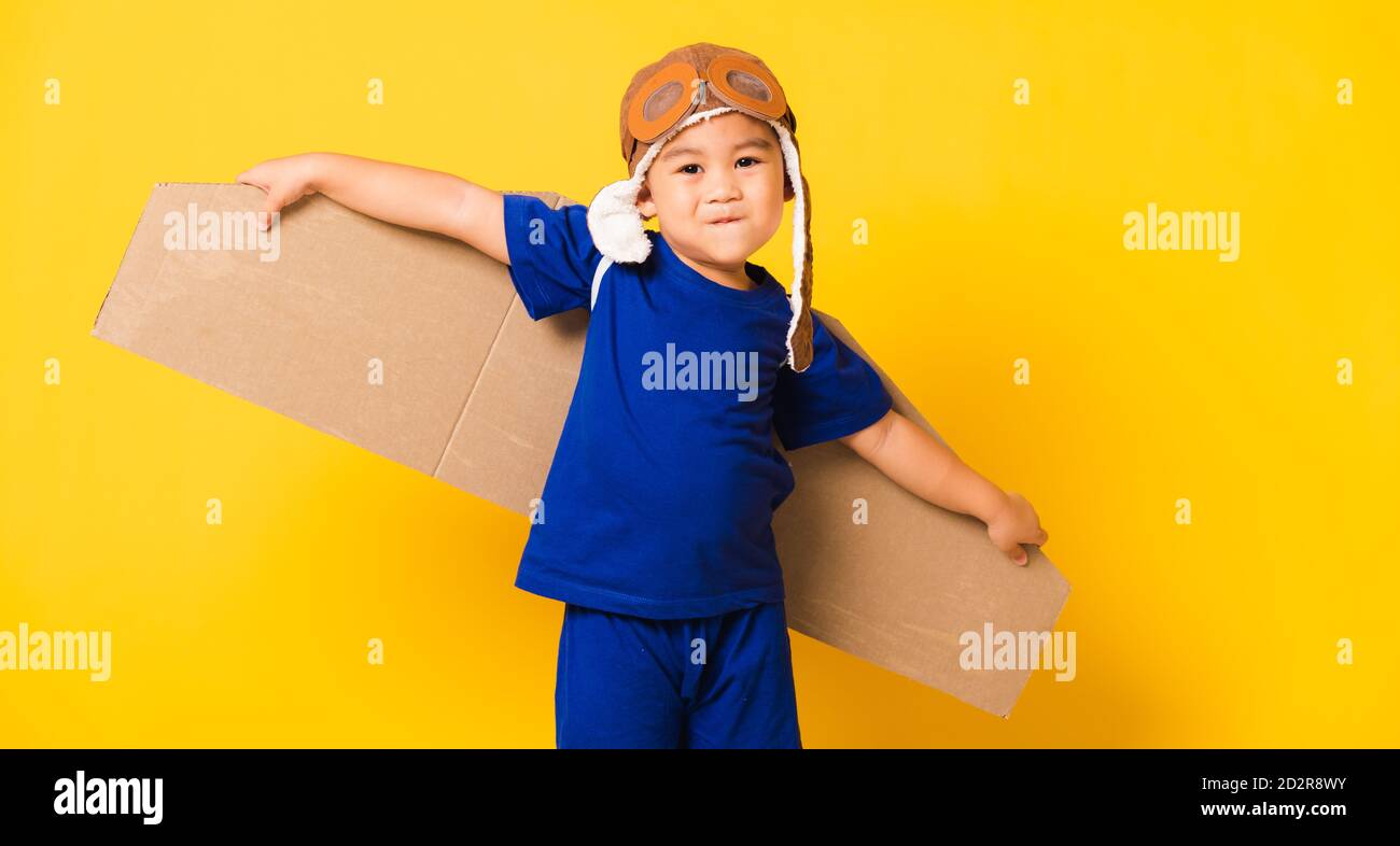 Happy Asian handsome funny child or kid little boy smile wear pilot hat ...