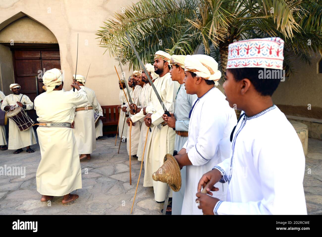 Traditional Omani sword dance in Nizwa fort, Oman Stock Photo - Alamy