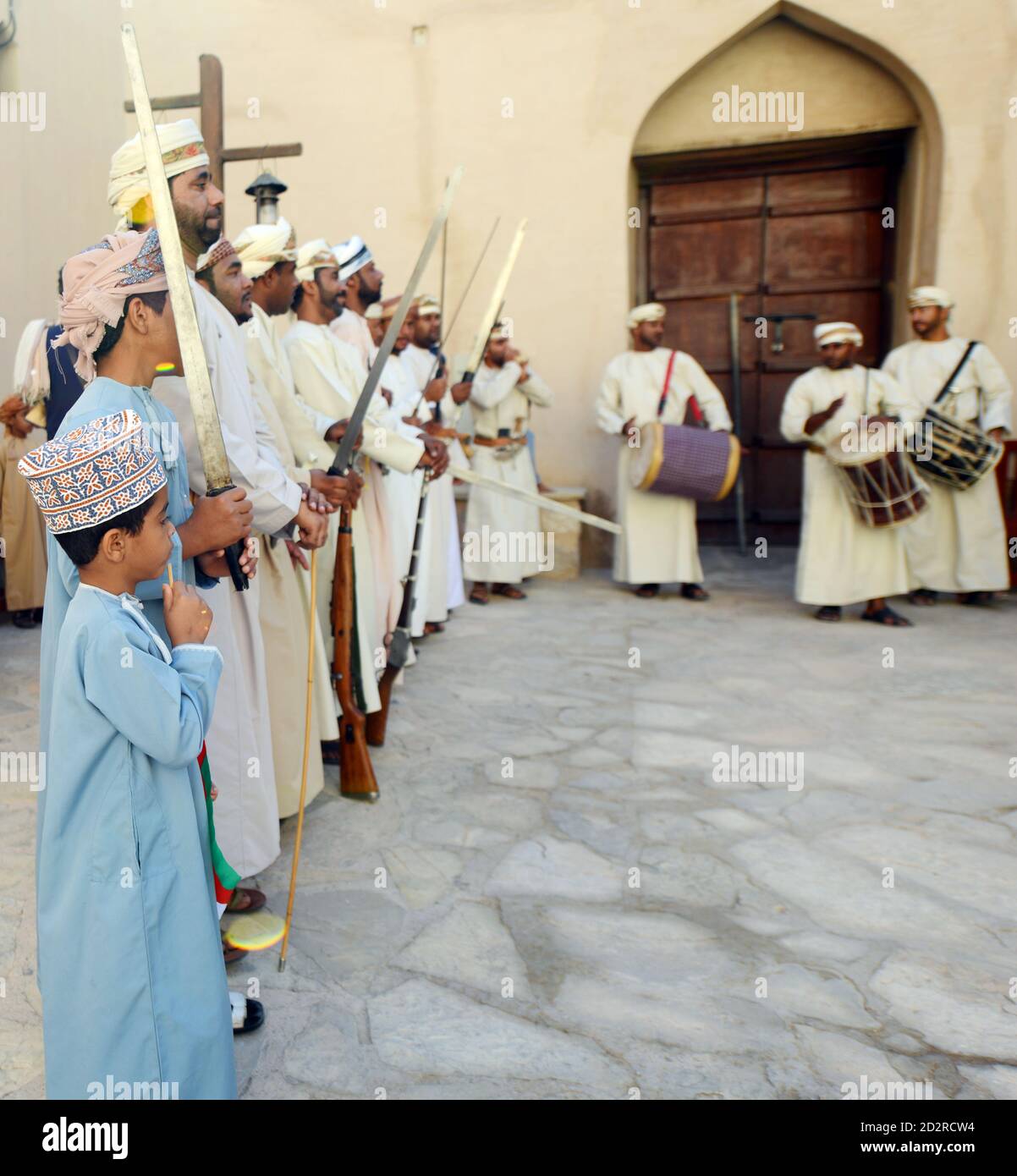 Traditional Omani sword dance in Nizwa fort, Oman Stock Photo - Alamy