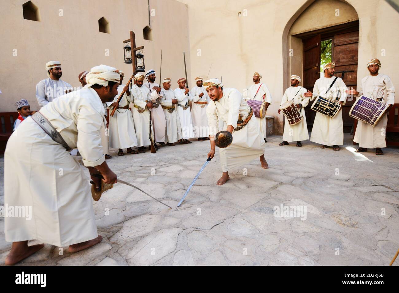 Traditional Omani sword dance in Nizwa fort, Oman Stock Photo - Alamy