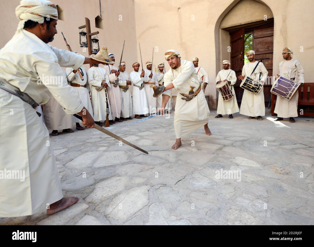 Traditional Omani sword dance in Nizwa fort, Oman Stock Photo - Alamy
