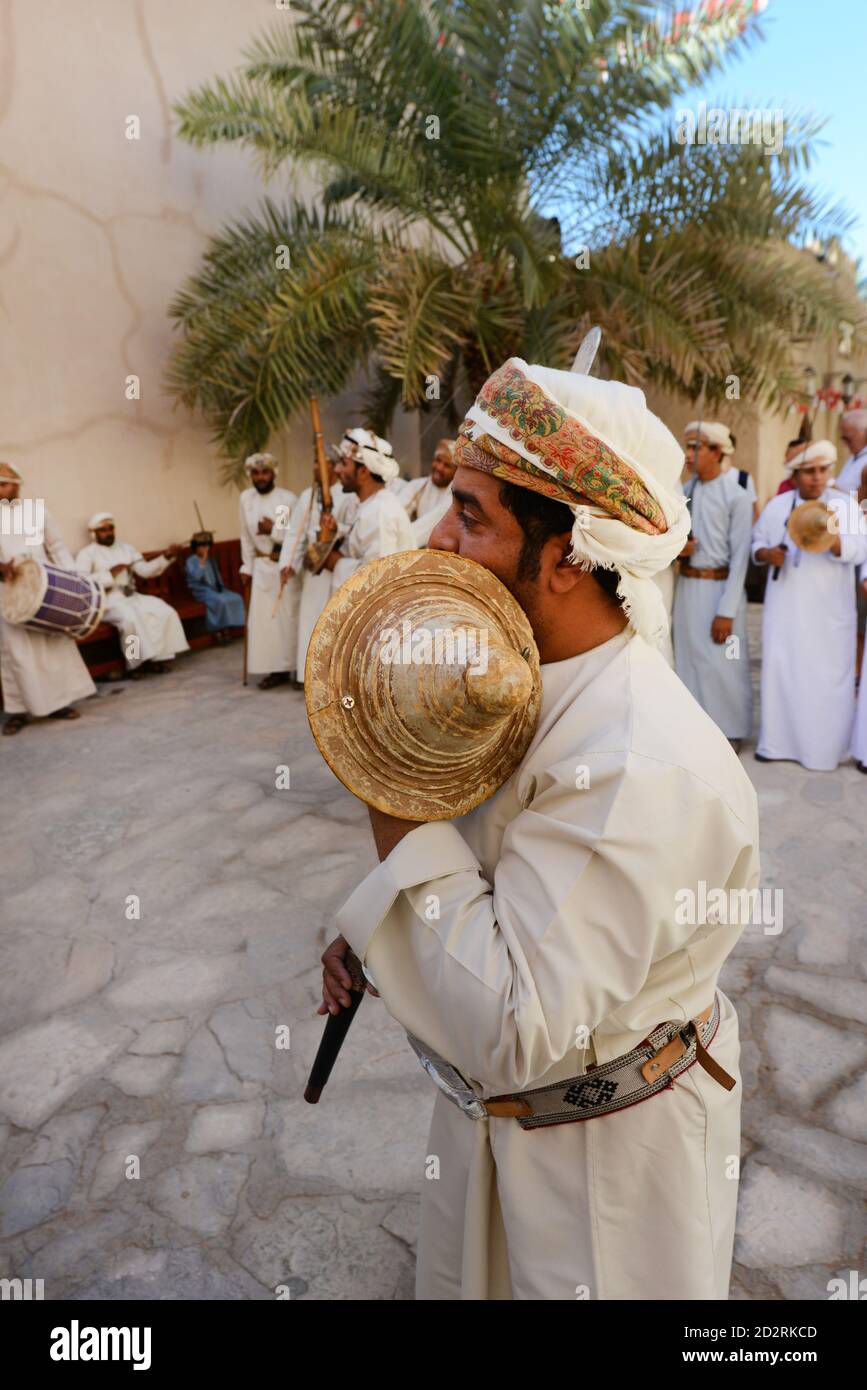 Traditional Omani sword dance in Nizwa fort, Oman Stock Photo - Alamy