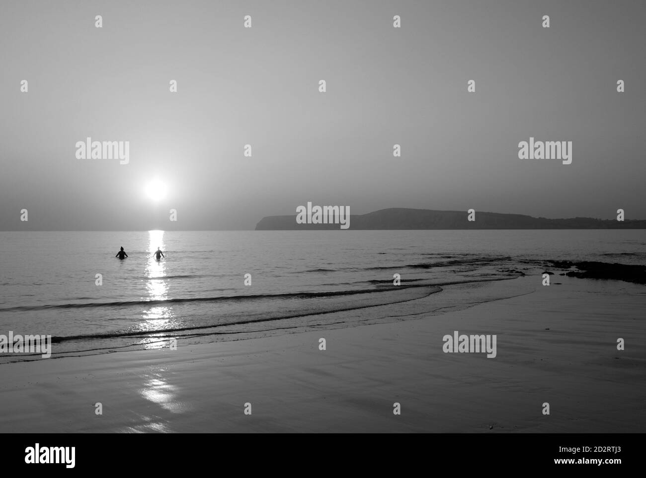Swimmers at sunset Compton Bay Isle of Wight Stock Photo - Alamy