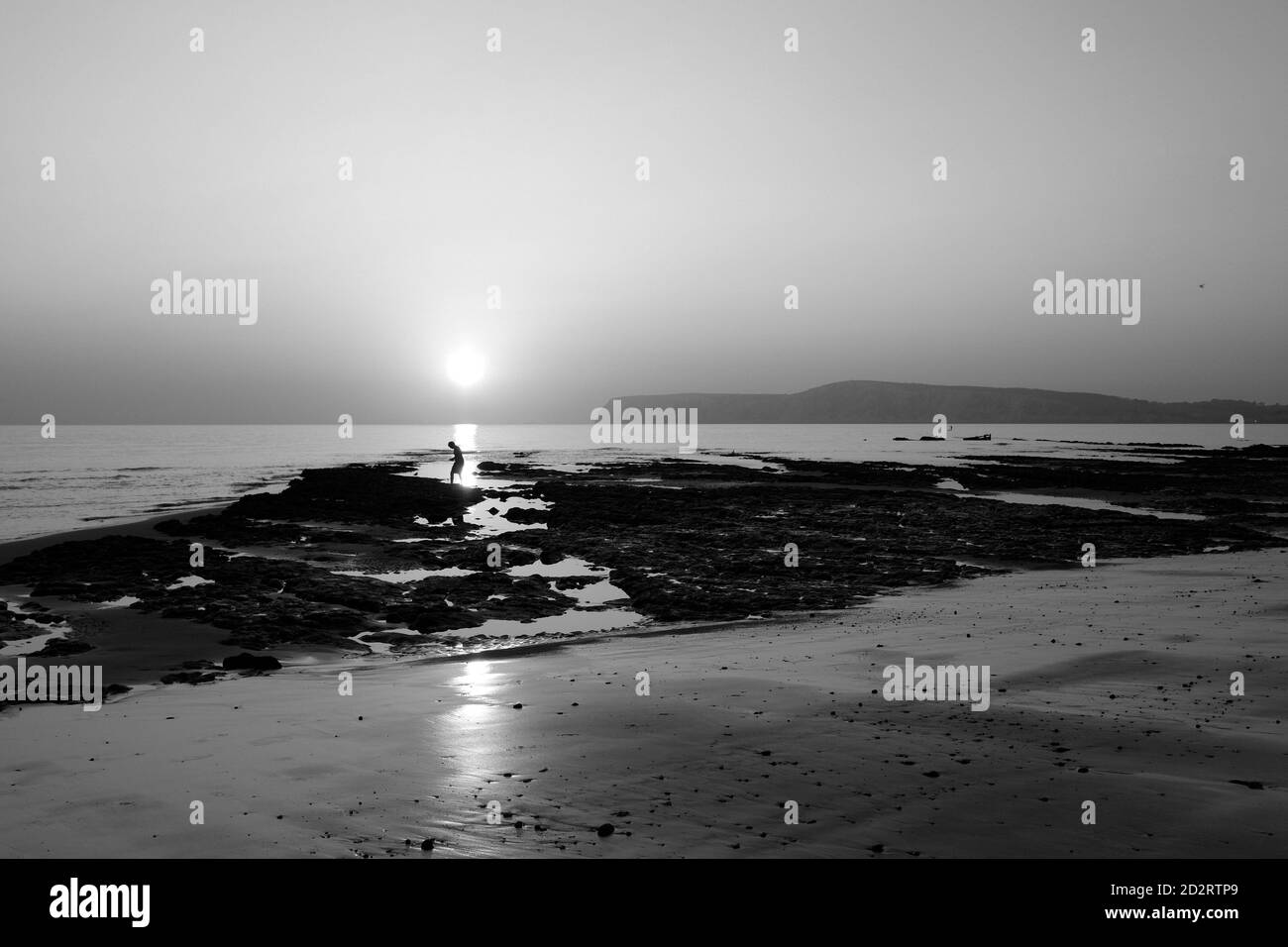 Rock pooling at sunset Compton Bay Isle of Wight Stock Photo - Alamy