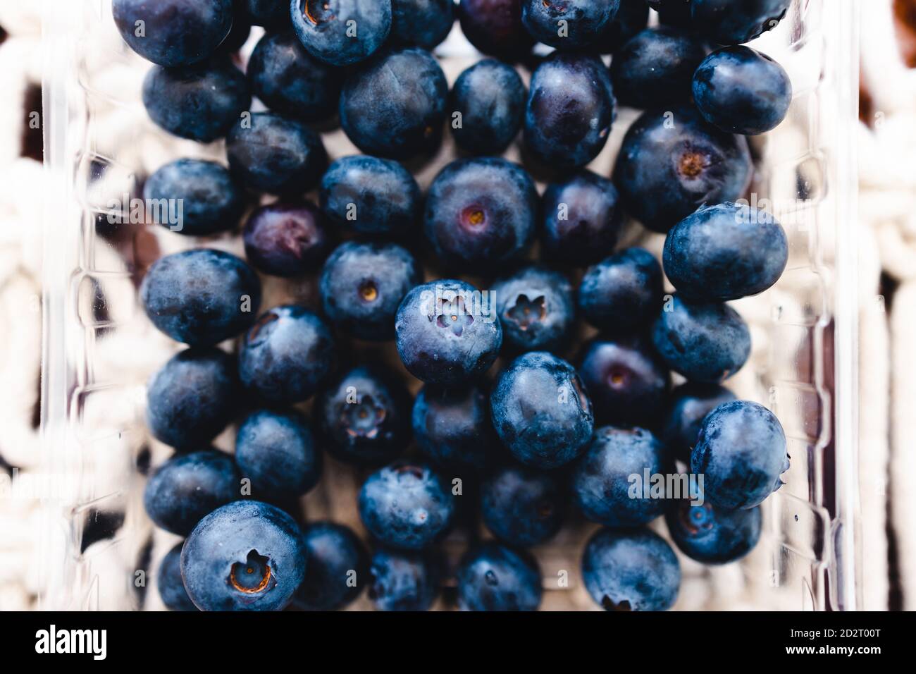 simple food ingredients concept, close-up of fresh blueberries in box ...