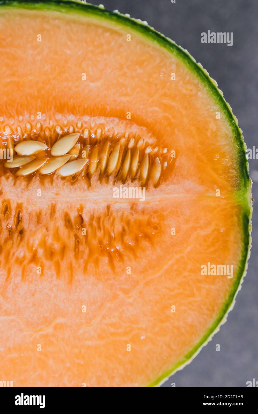 simple food ingredients concept, close-up of rockmelon on cutting board ...