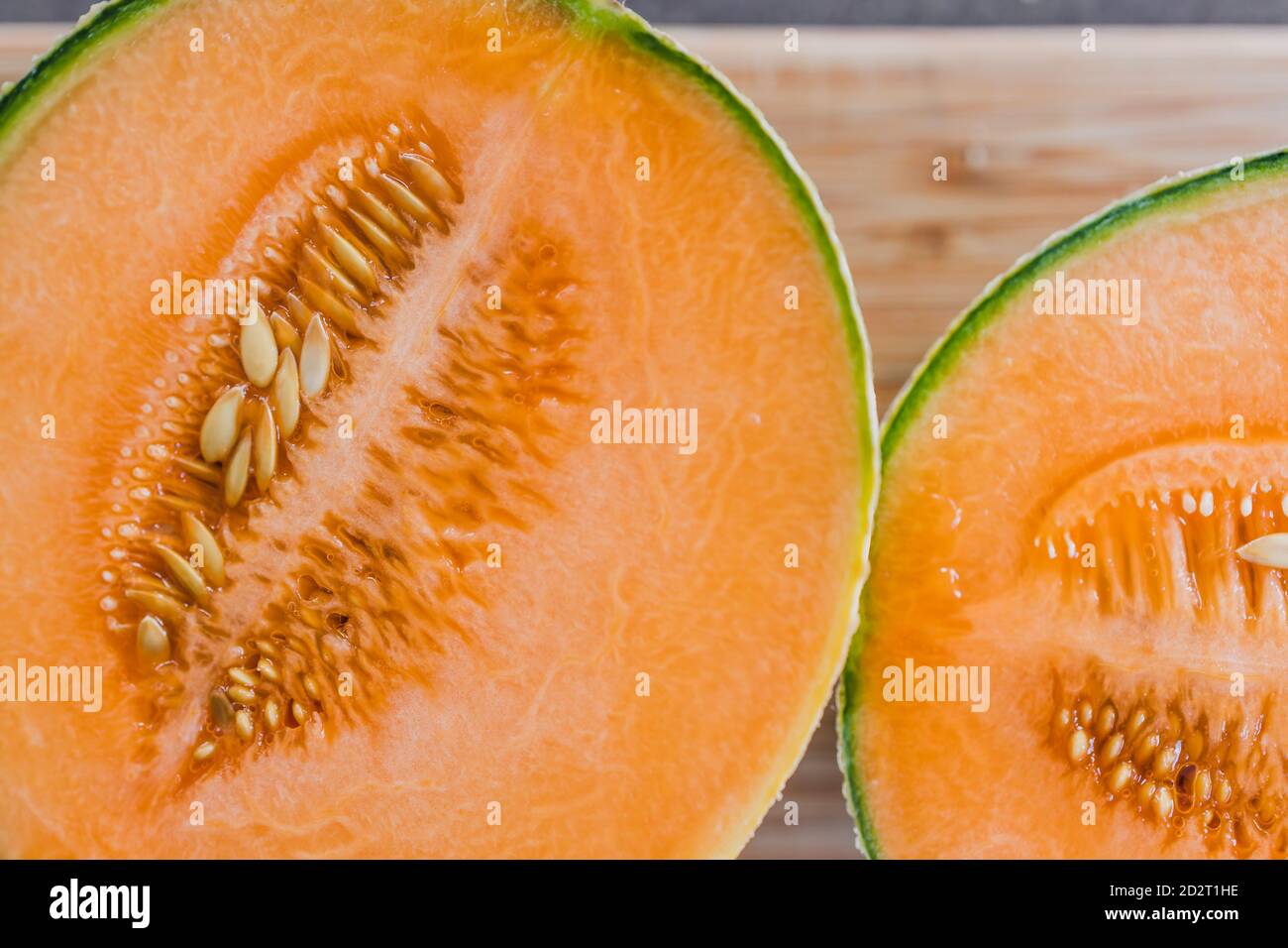 simple food ingredients concept, close-up of rockmelon on cutting board ...