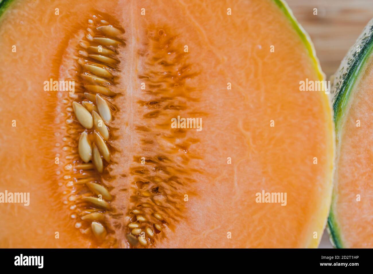 simple food ingredients concept, close-up of rockmelon on cutting board ...