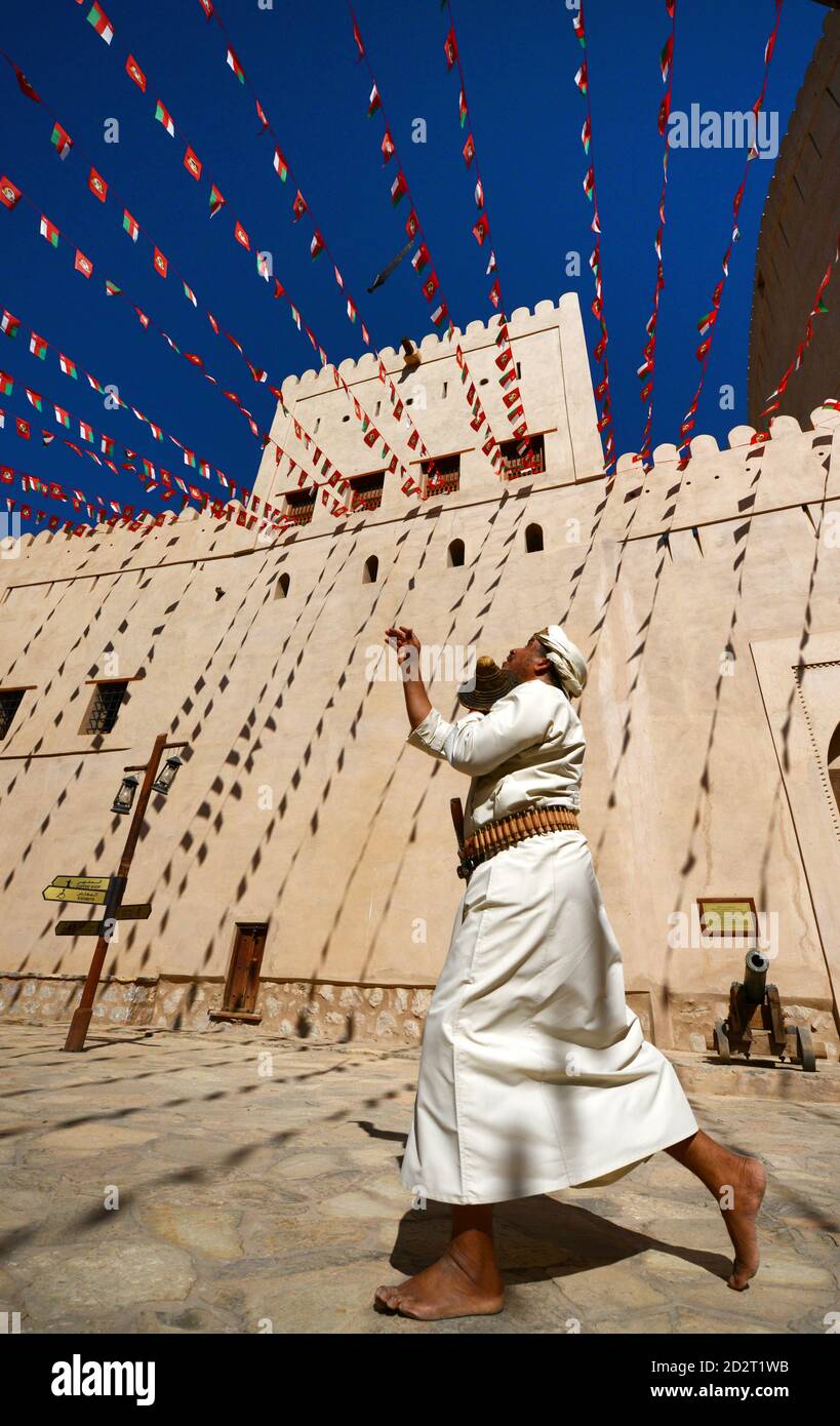 Traditional Omani sword dance in Nizwa fort, Oman Stock Photo - Alamy