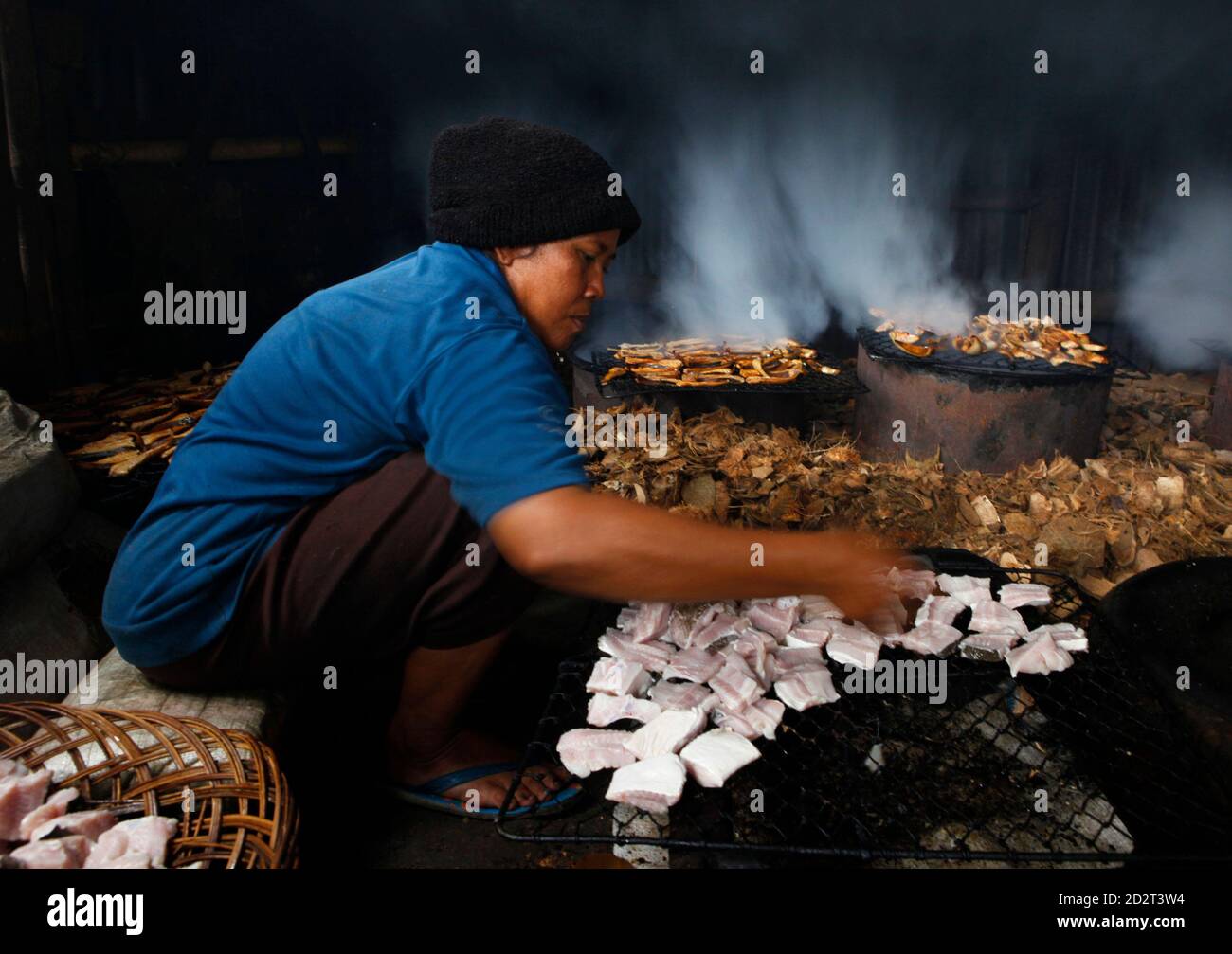 Woman processing fish hi-res stock photography and images - Alamy