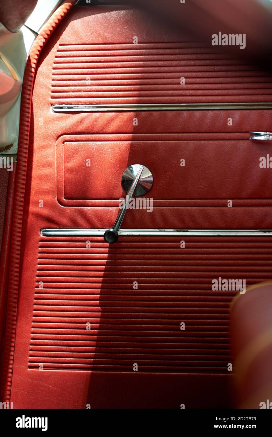 Detail of vintage car with leather door and metal shiny handles parked ...