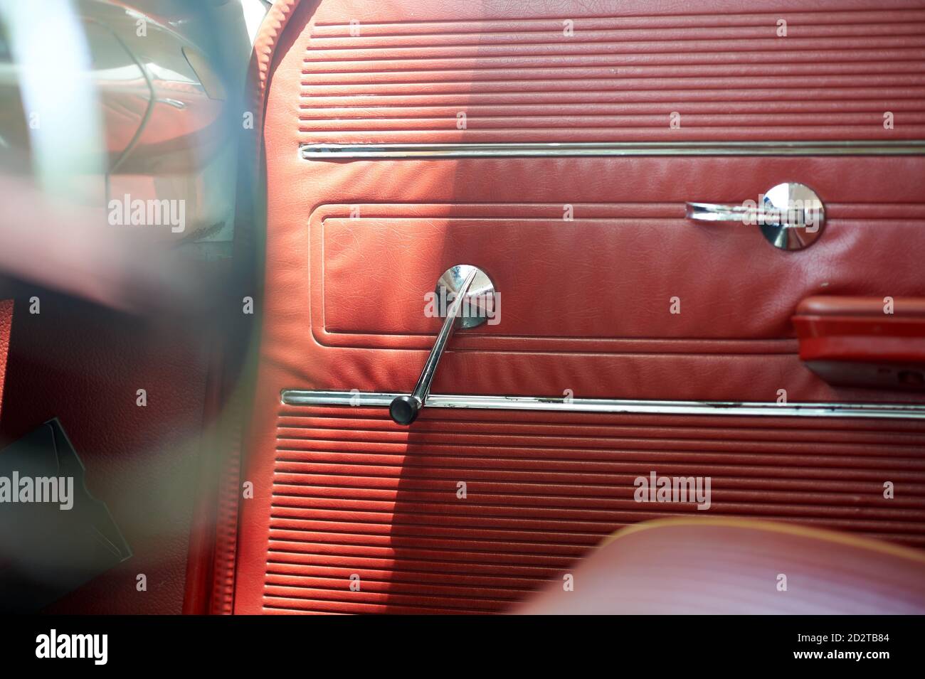 Detail of vintage car with leather door and metal shiny handles parked ...